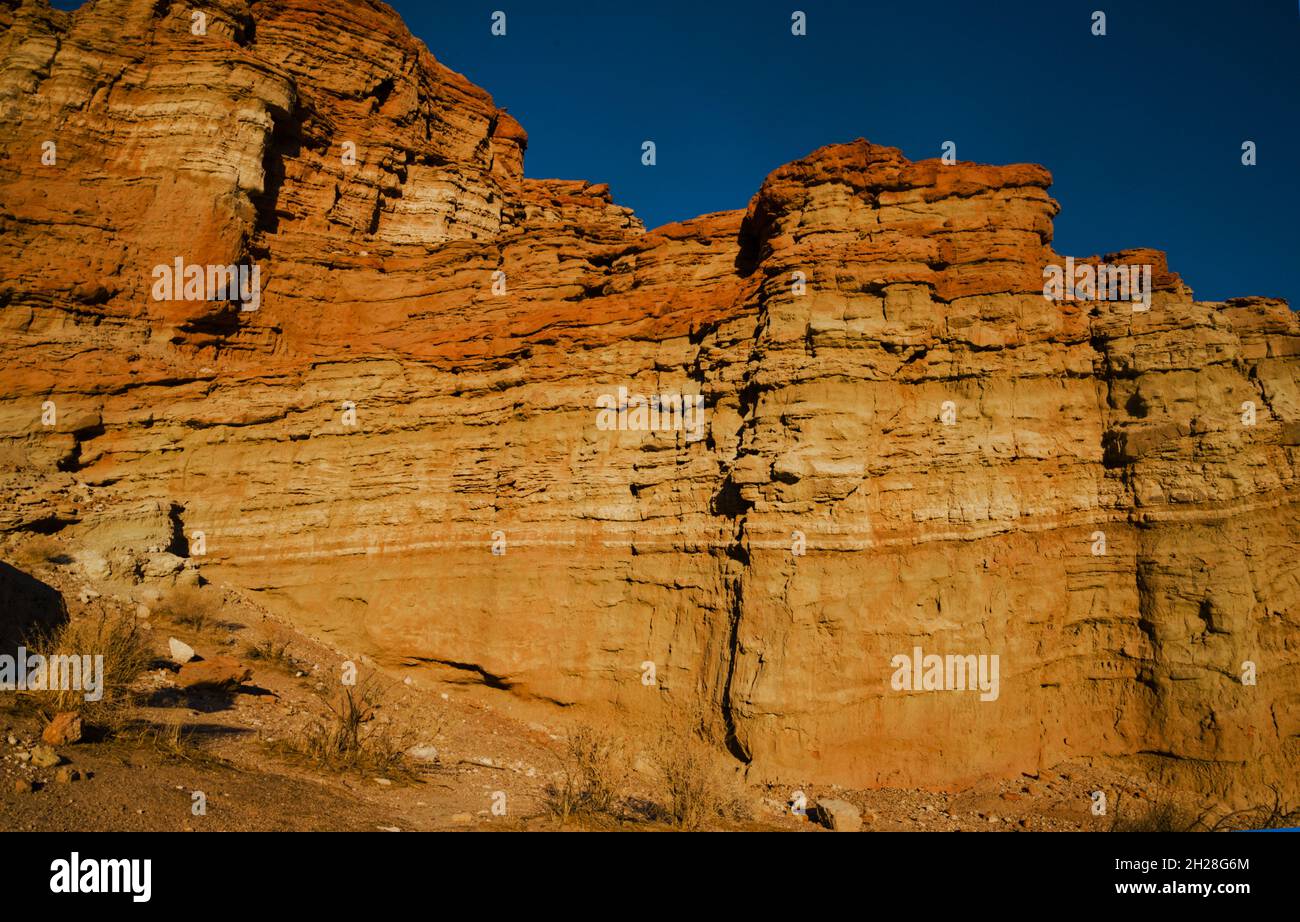 Red rock huge stone formation in desert vivid in color and rich in ...