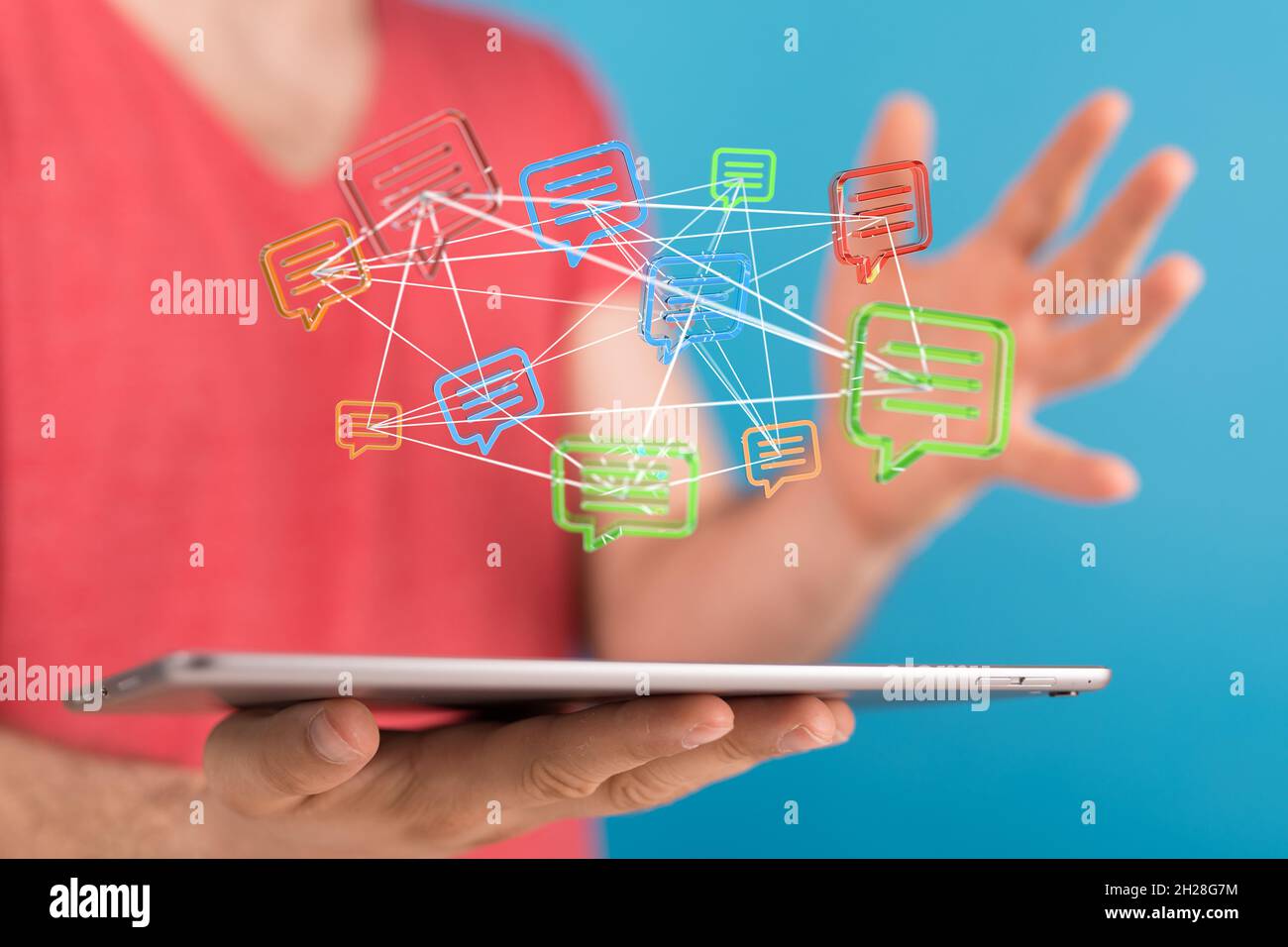 3D rendered colorful dialog speech symbols over the tablet in the male ...