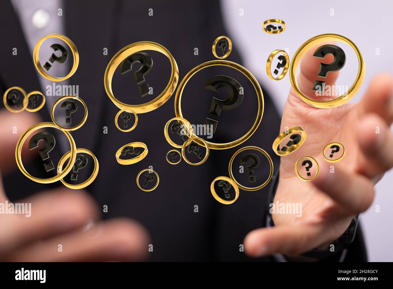3D rendered digital question mark symbols in the hands of a male in the ...