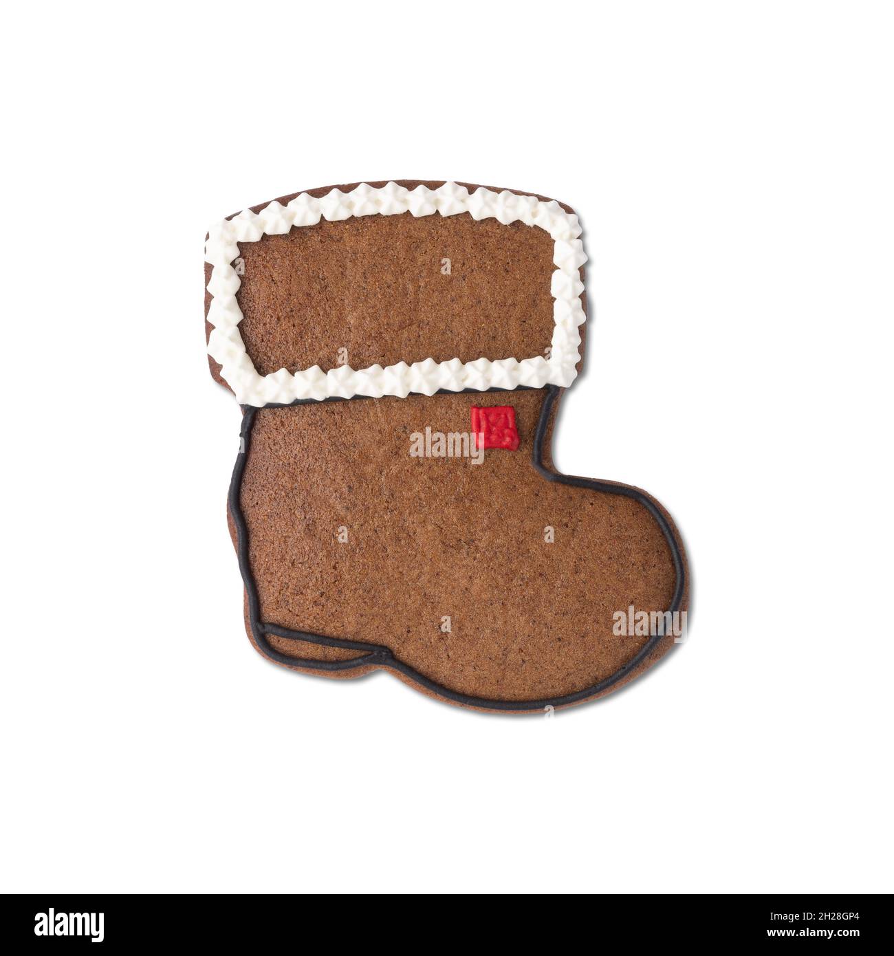 Boot shaped traditional christmas gingerbread cookie isolated over ...