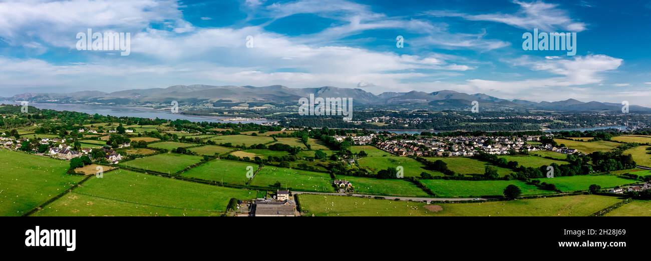 Aerial view of snowdonia landscape in the distance from Anglesey Stock ...