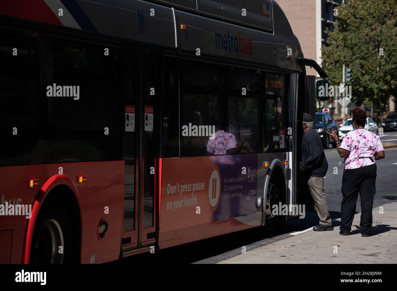 Washington, USA. 20th Oct, 2021. A general view of people boarding a WMATA Metrobus, in ...