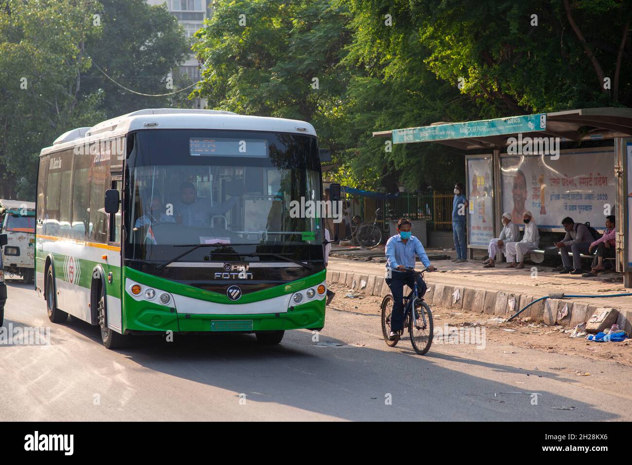 An electric bus seen at a bus stop waiting for passengers. Cashless ...
