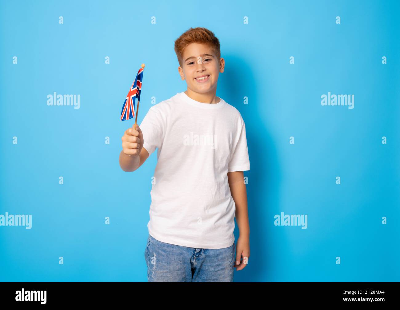 Boy student holding national flag hi-res stock photography and images ...
