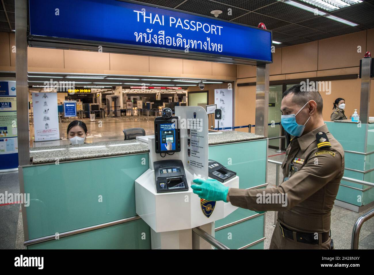 Bangkok, Thailand. 20th Oct, 2021. Immigration officers wearing face ...
