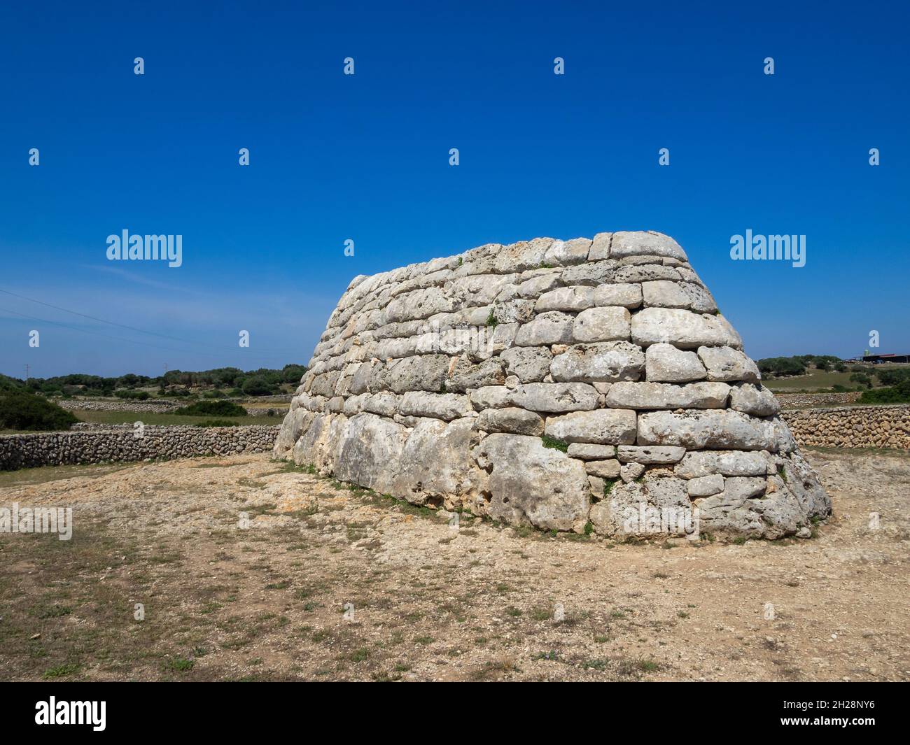 Naveta des Tudons, megalithic chamber tomb seen from the back, Menorca ...