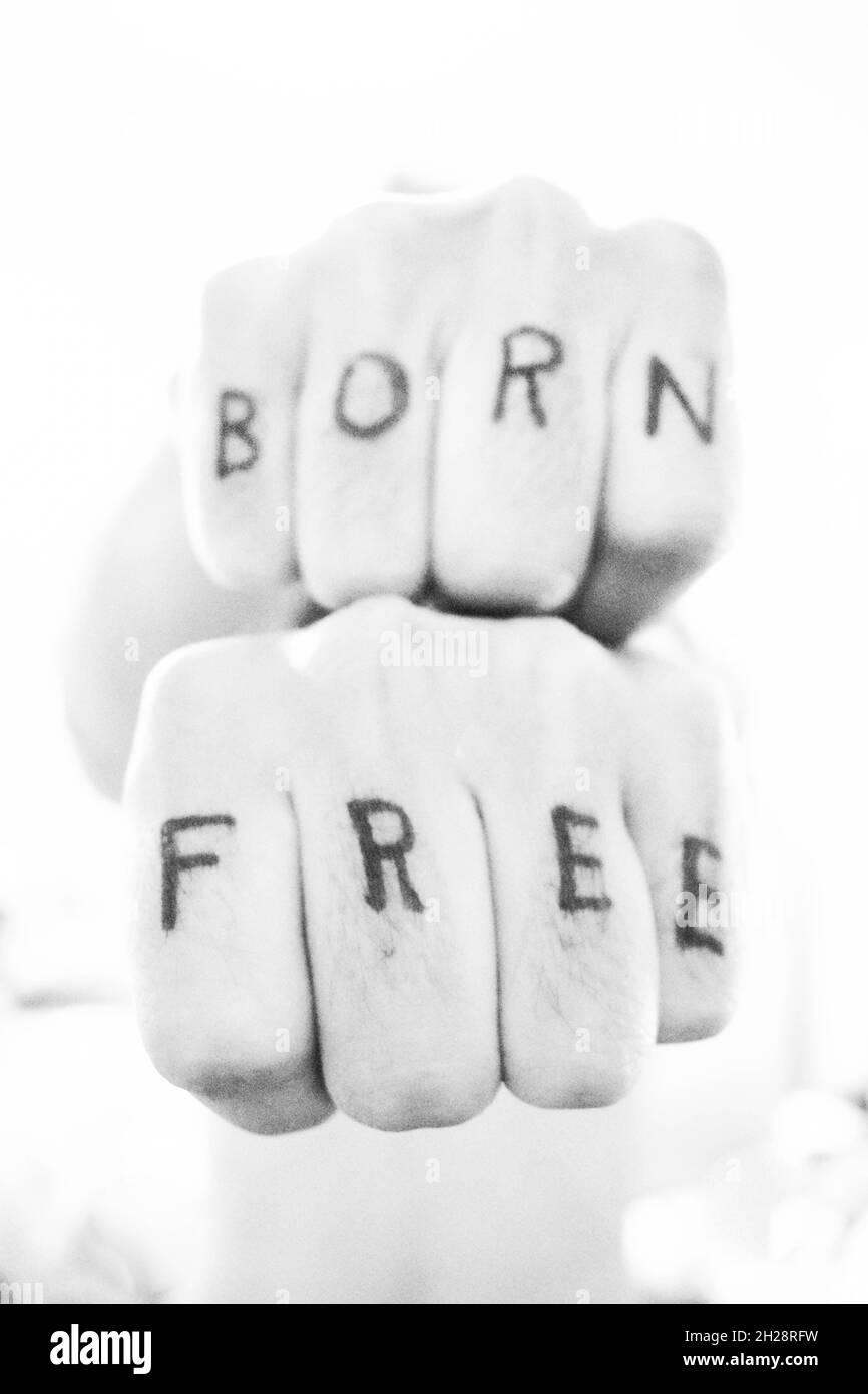 Tattooed hands born free Stock Photo - Alamy