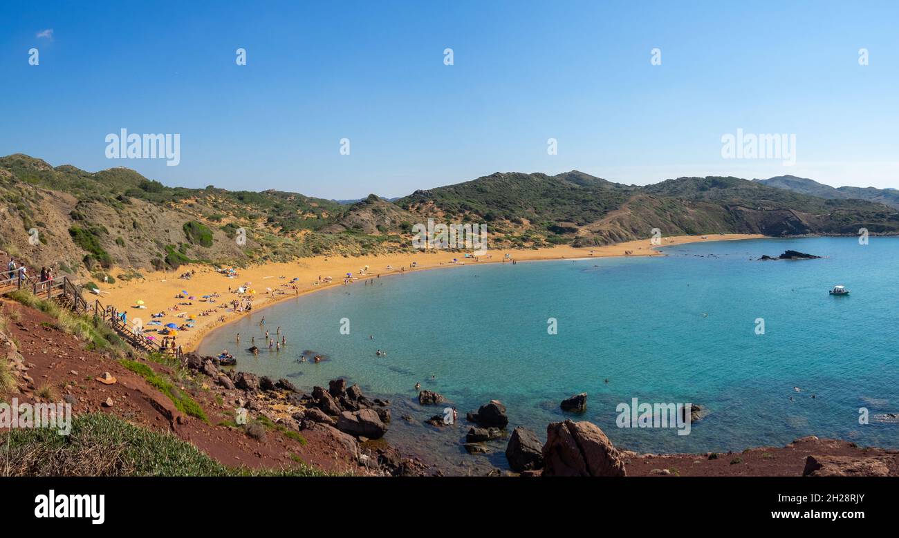 Panorama of the red sand beach Platja de Cavalleria, Menorca Stock ...