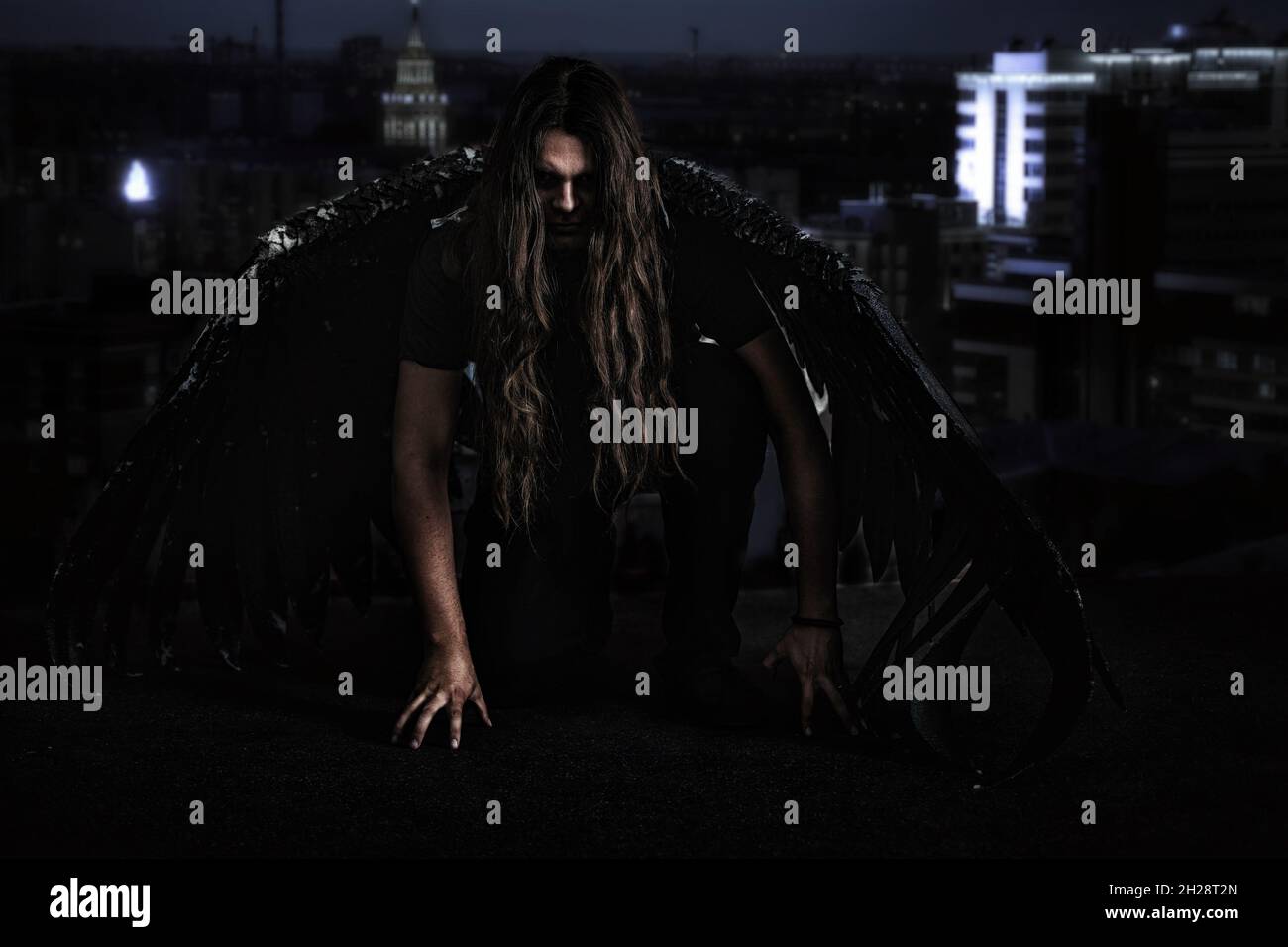 Man with black wings, fallen angel concept Stock Photo - Alamy
