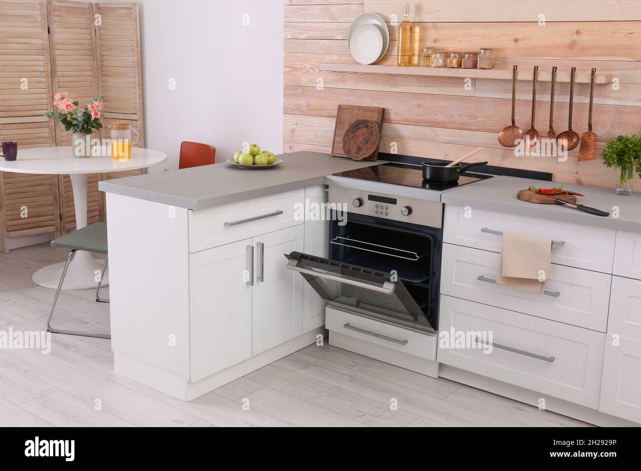 Light modern kitchen interior with new oven Stock Photo - Alamy