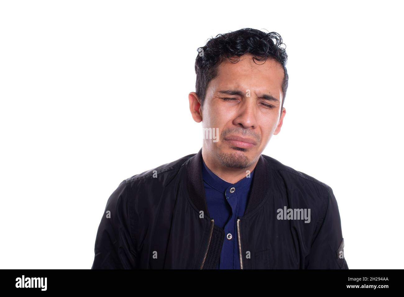 Man about to cry from pain isolated on white background. Expression of ...
