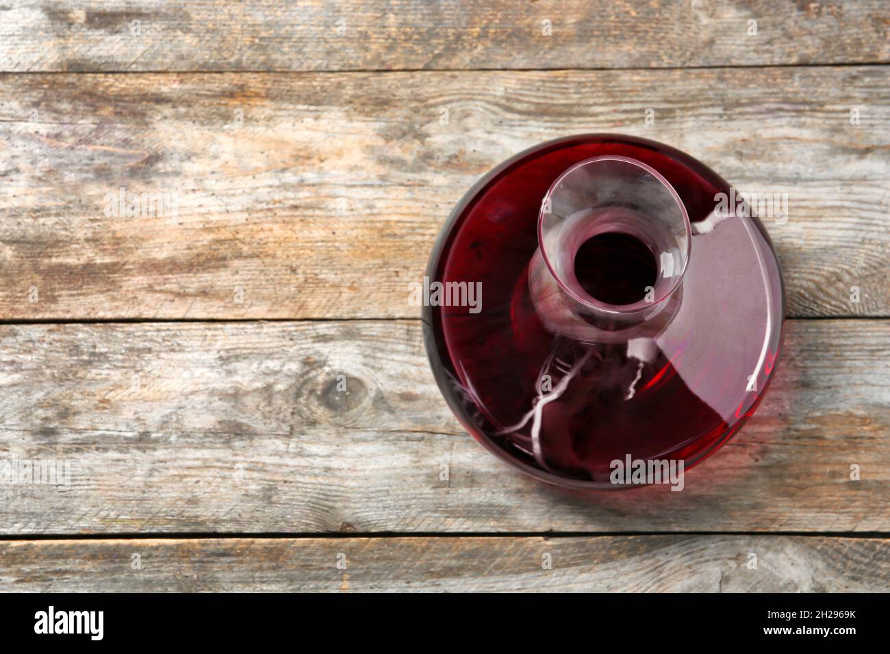 Decanter with red wine on wooden background, top view Stock Photo - Alamy