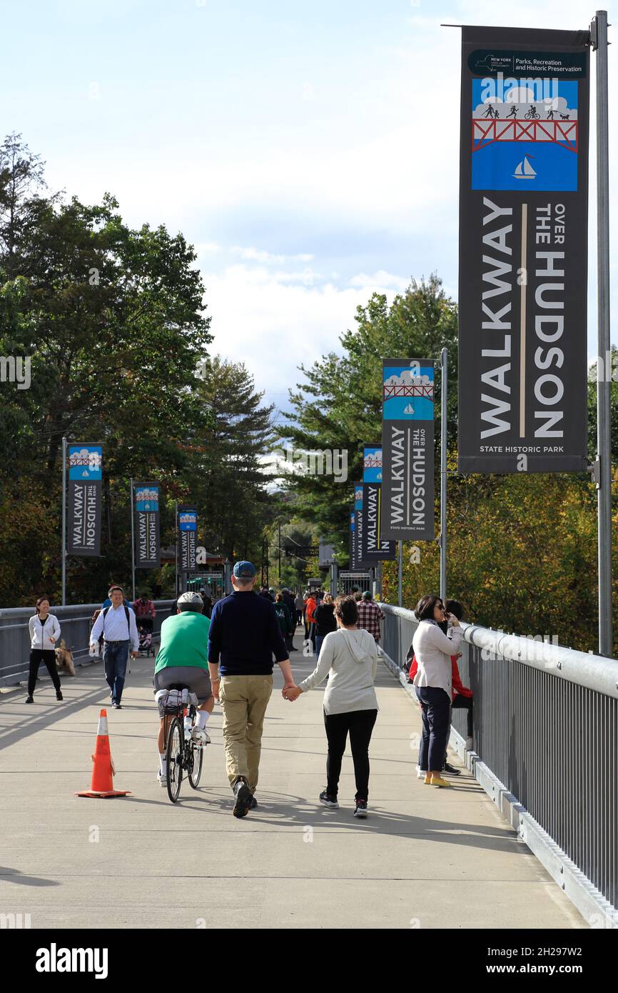 Visitors walking by the banners of "Walkway over the Hudson" decorating ...