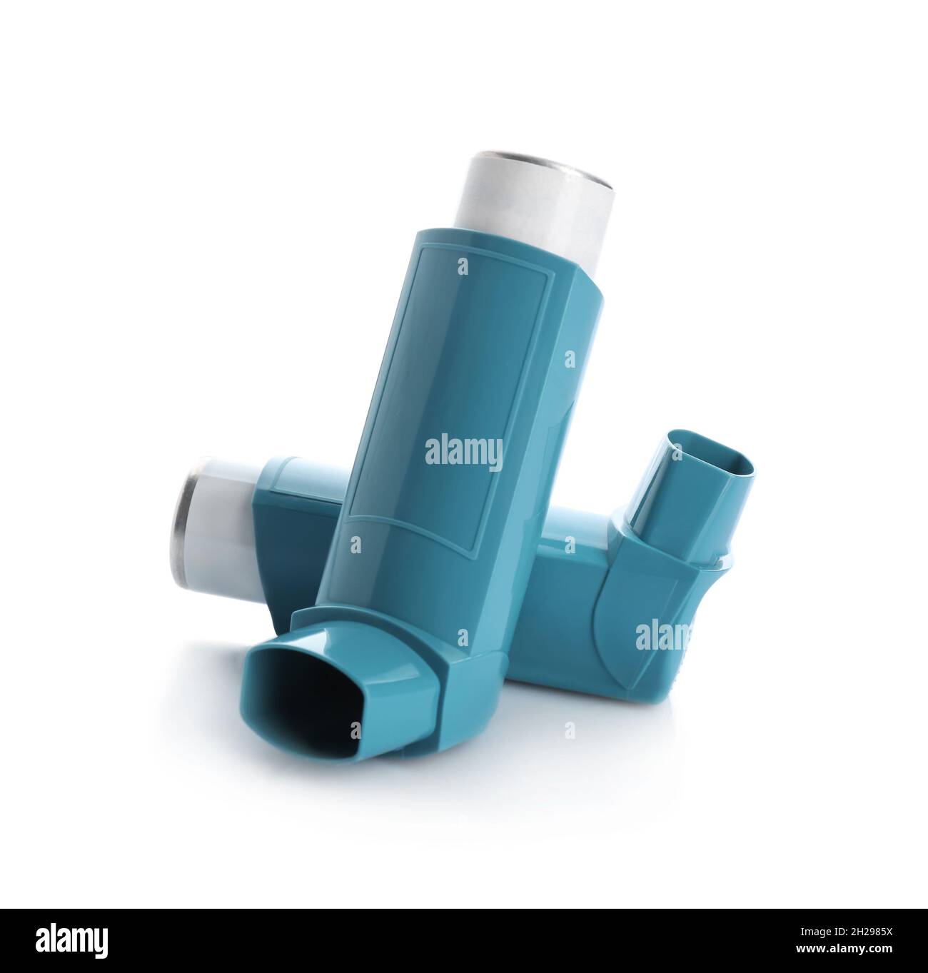 Two portable asthma inhalers on white background Stock Photo - Alamy