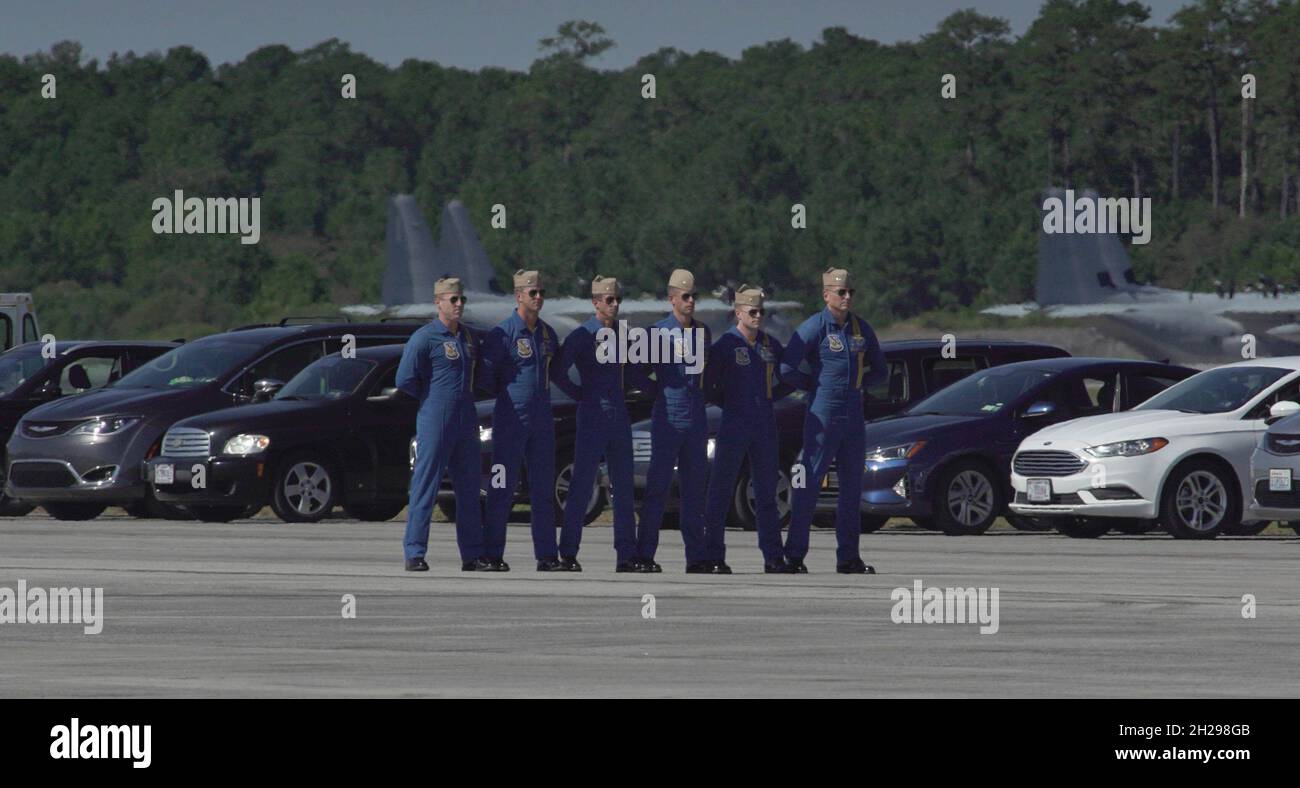 U.S. Navy Blue Angel pilots stand at parade rest, preparing to board ...