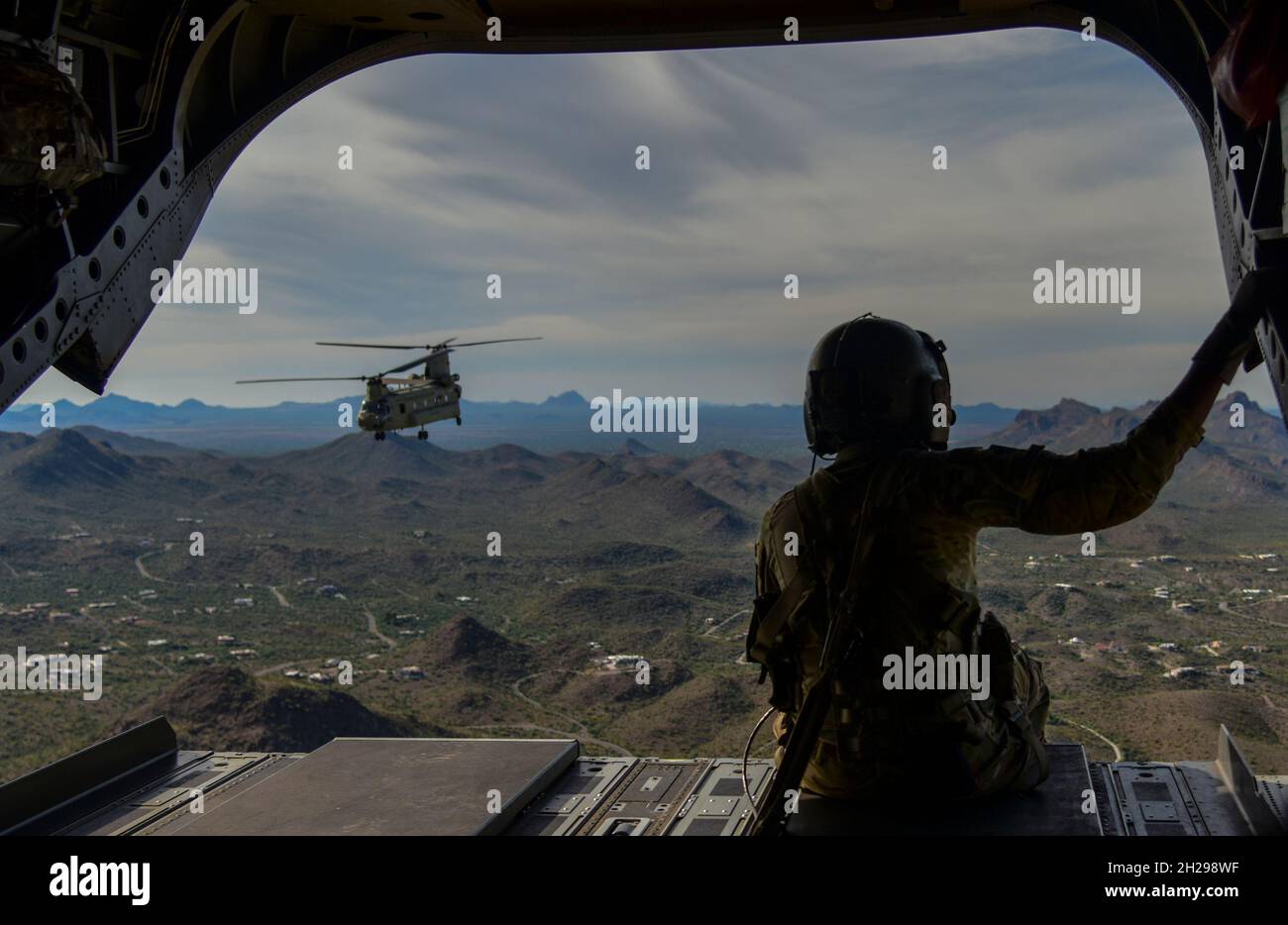 U.S. Army Staff Sgt. Joseph Kayitare, a CH-47 Chinook crew chief ...