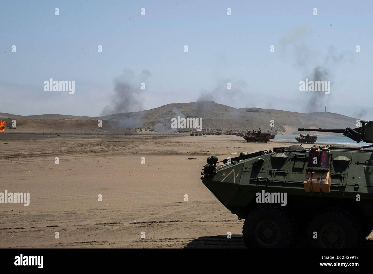 Peruvian and U.S. light armored vehicles conduct an amphibious assault ...