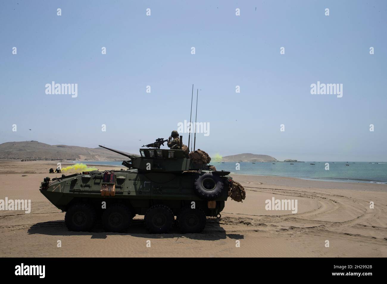 A U.S. Marine Corps light armored vehicle prepares to fire during an ...