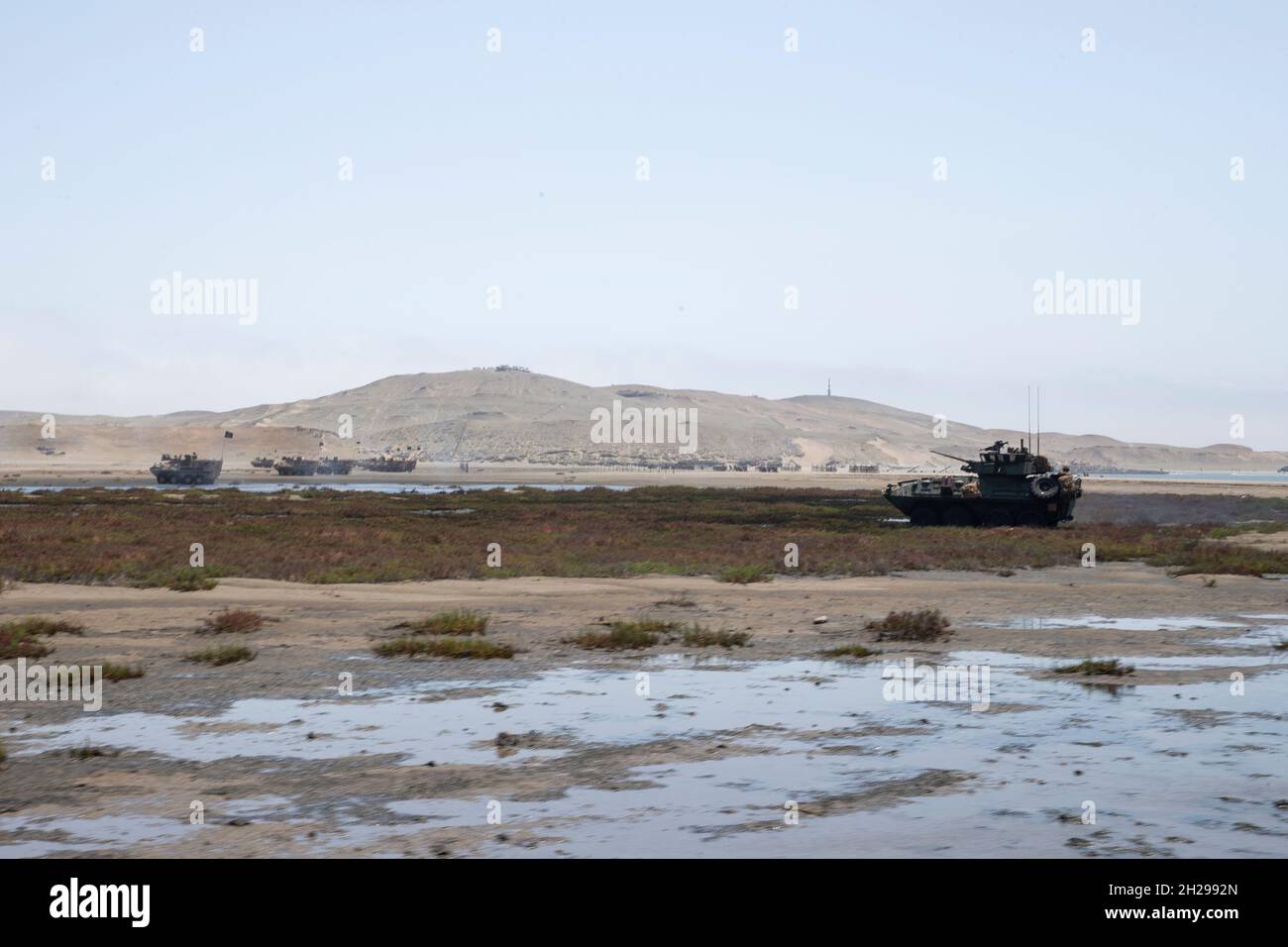 Peruvian and U.S. light armored vehicles conduct an amphibious assault ...