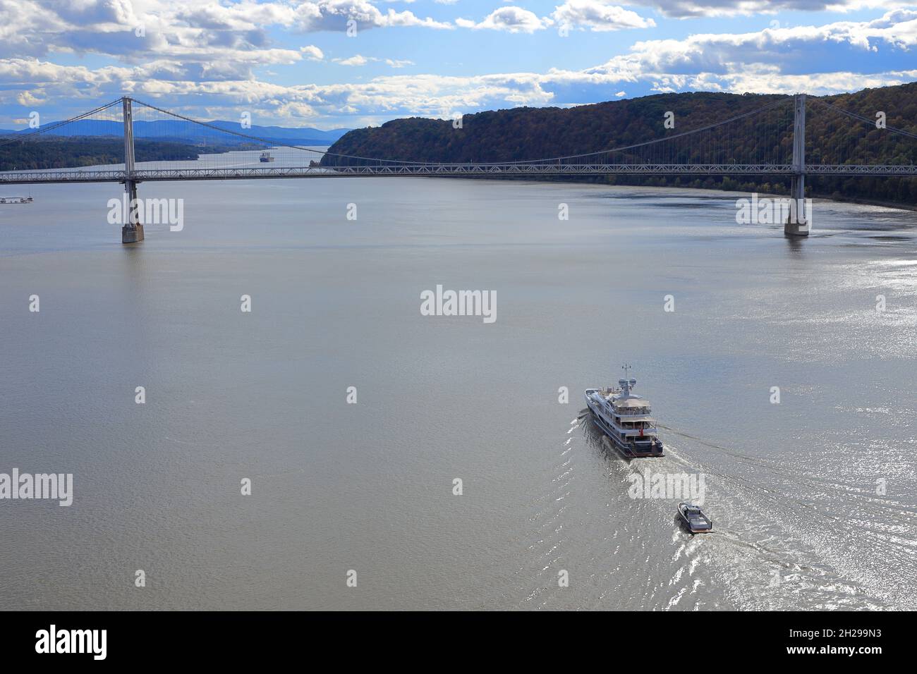 The view of a yacht in Hudson River with Mid-Hudson Bridge in ...
