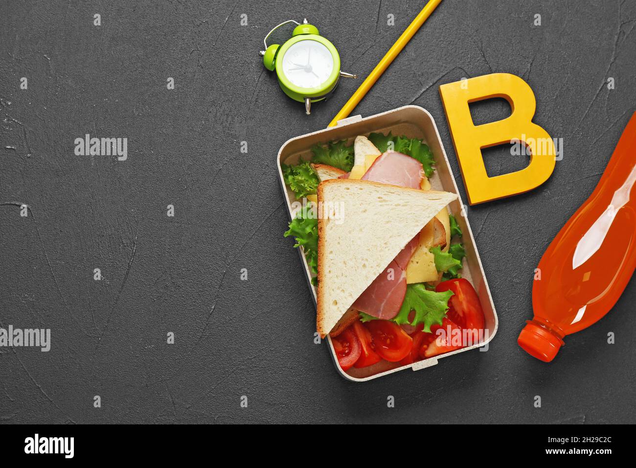 Flat lay composition with lunch box and appetizing food for school on ...