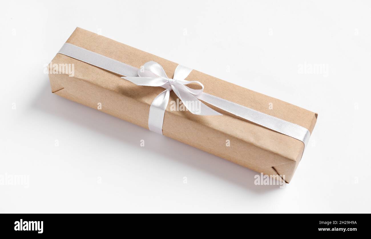 Beautifully wrapped gift box on white background Stock Photo - Alamy