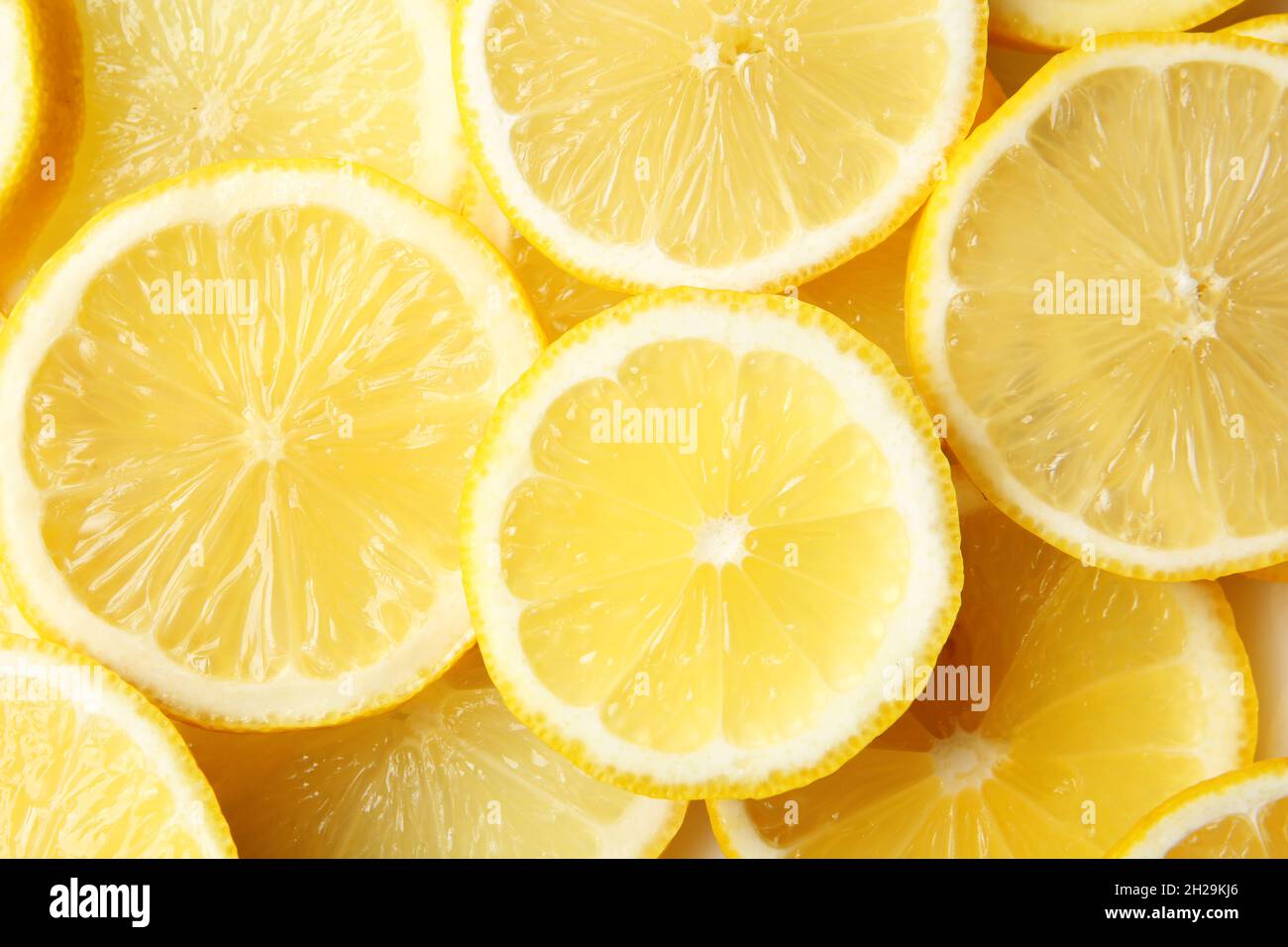 Many slices of fresh ripe lemons as background Stock Photo - Alamy