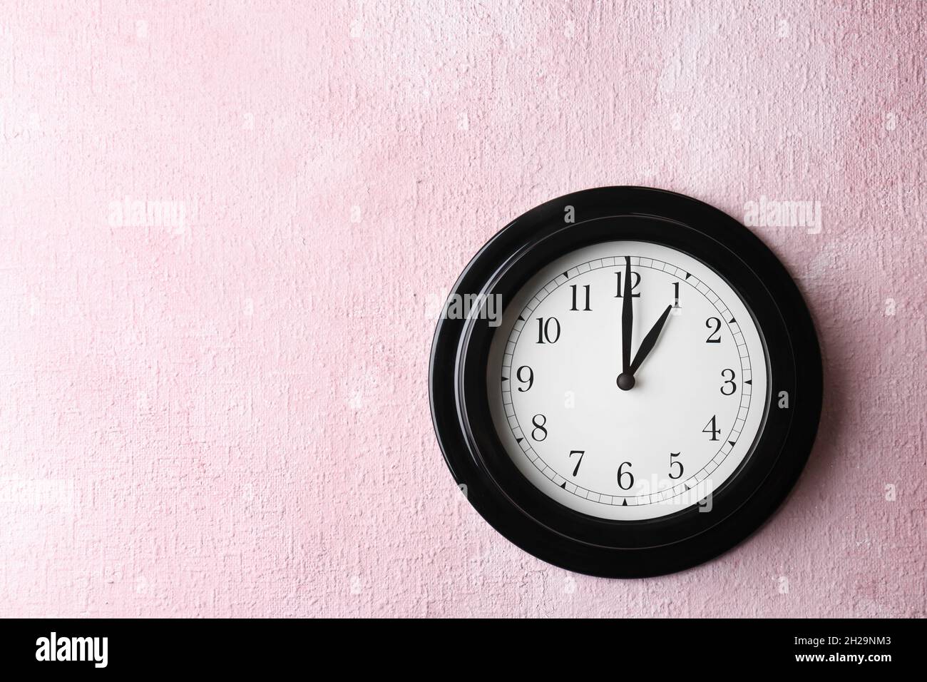 Big black clock on color background. Time change concept Stock Photo ...