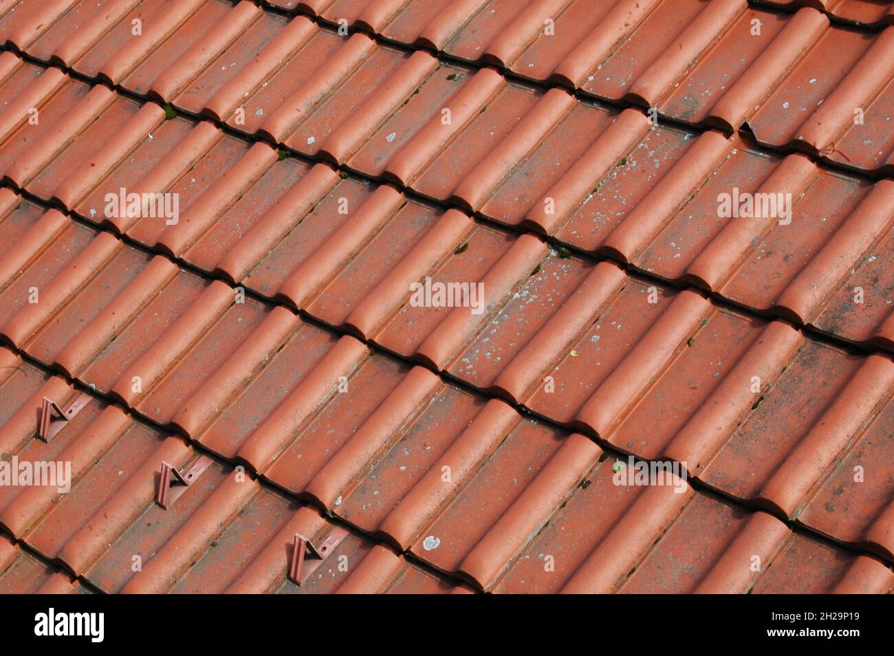 Closeup shot of shingles roof, red shingles tile roofing texture Stock ...