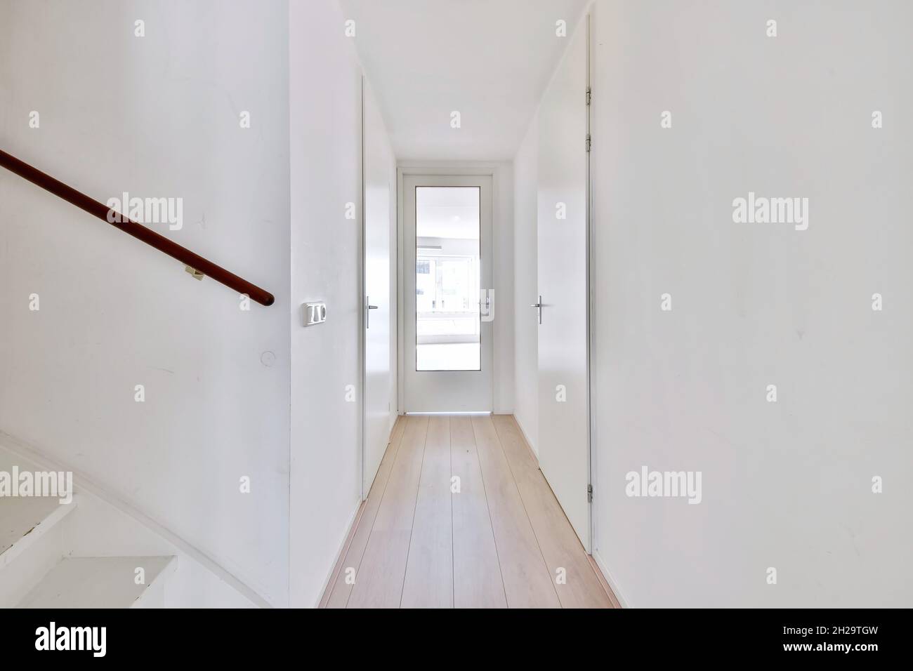 A long empty corridor designed in minimalistic style Stock Photo - Alamy