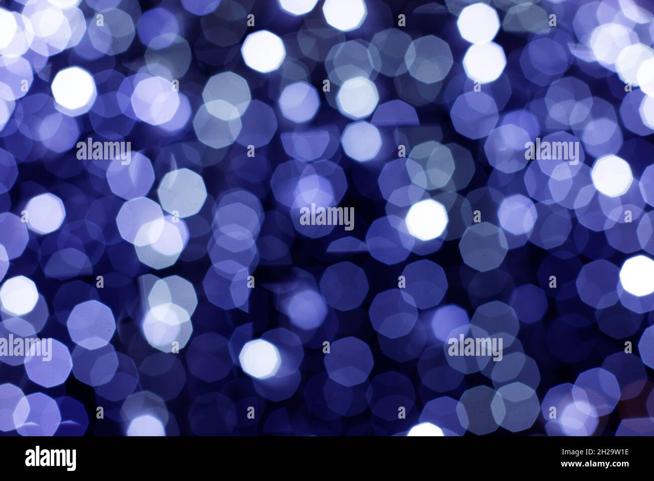 Defocused Blue and White abstract bokeh lights background. Festive lights. Blurred holiday bokeh ...