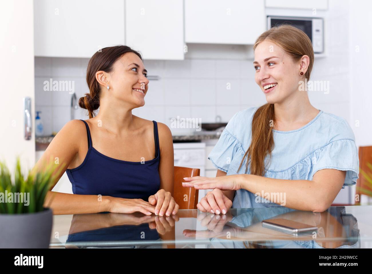 Female best friends having conversation hi-res stock photography and ...