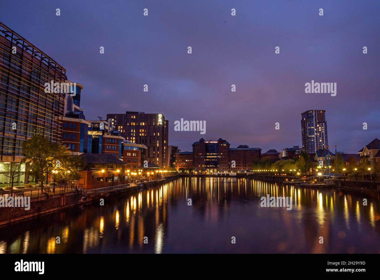 Modern water area buildings illuminated downtown town skyline business ...