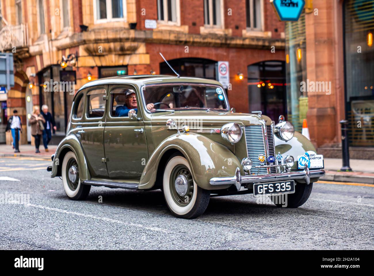 Retro car driving down the streets of Manchester Stock Photo - Alamy
