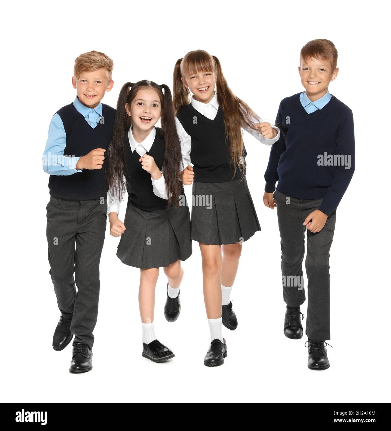 Little children in stylish school uniform on white background Stock ...
