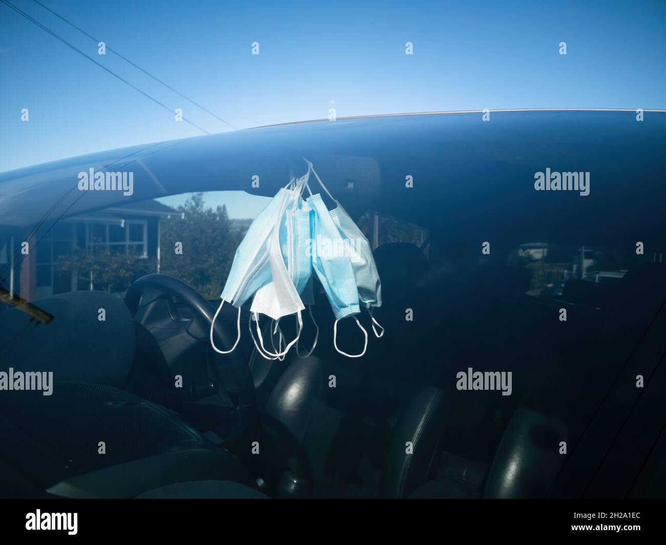 Protecti face masks inside empty car view through windscreen Stock ...