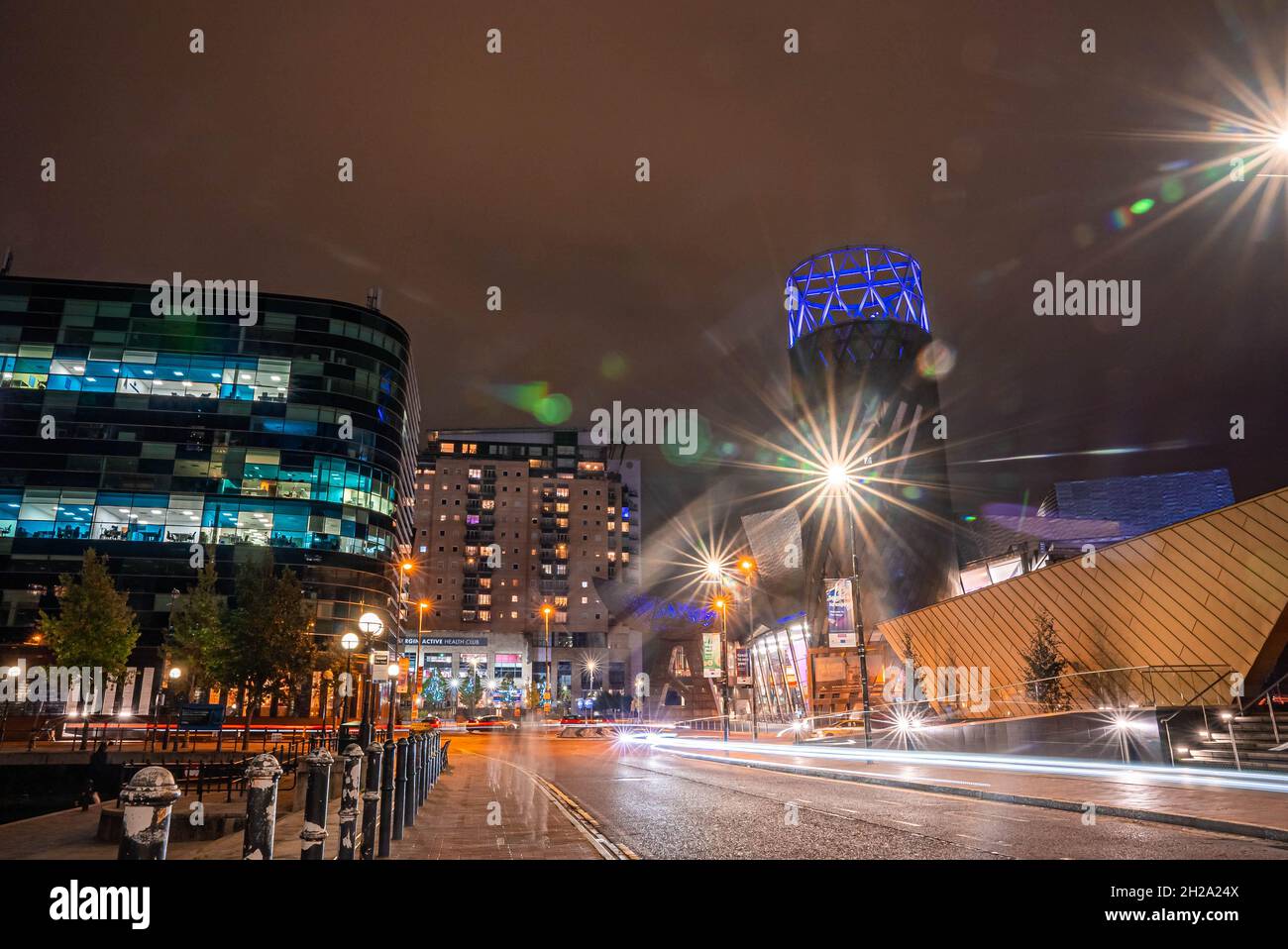 Long exposure at night of traffic passing in Manchester Central Stock ...