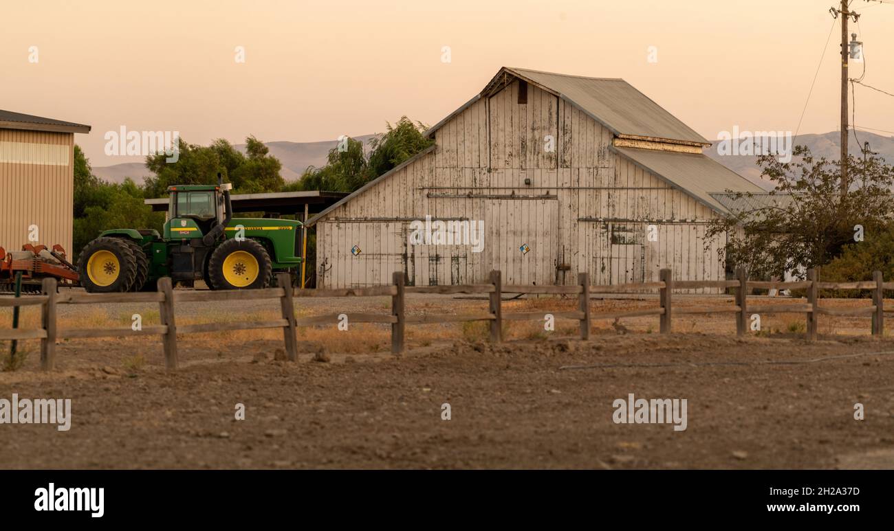 White Barn and John Deer Tractor Stock Photo - Alamy