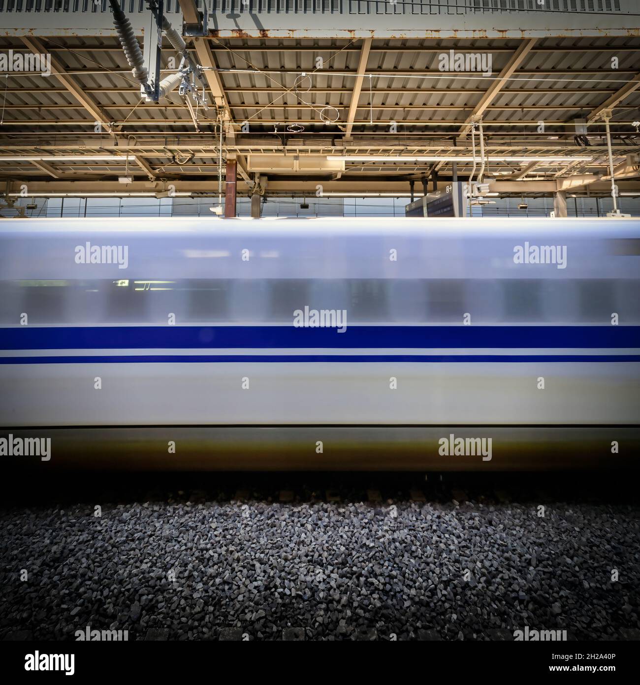 The Shinkansen, Japanese Bullet Train, passes through a station in ...