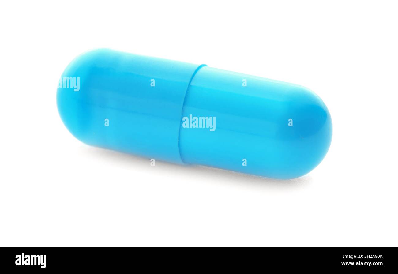 Blue capsule on white background Stock Photo - Alamy
