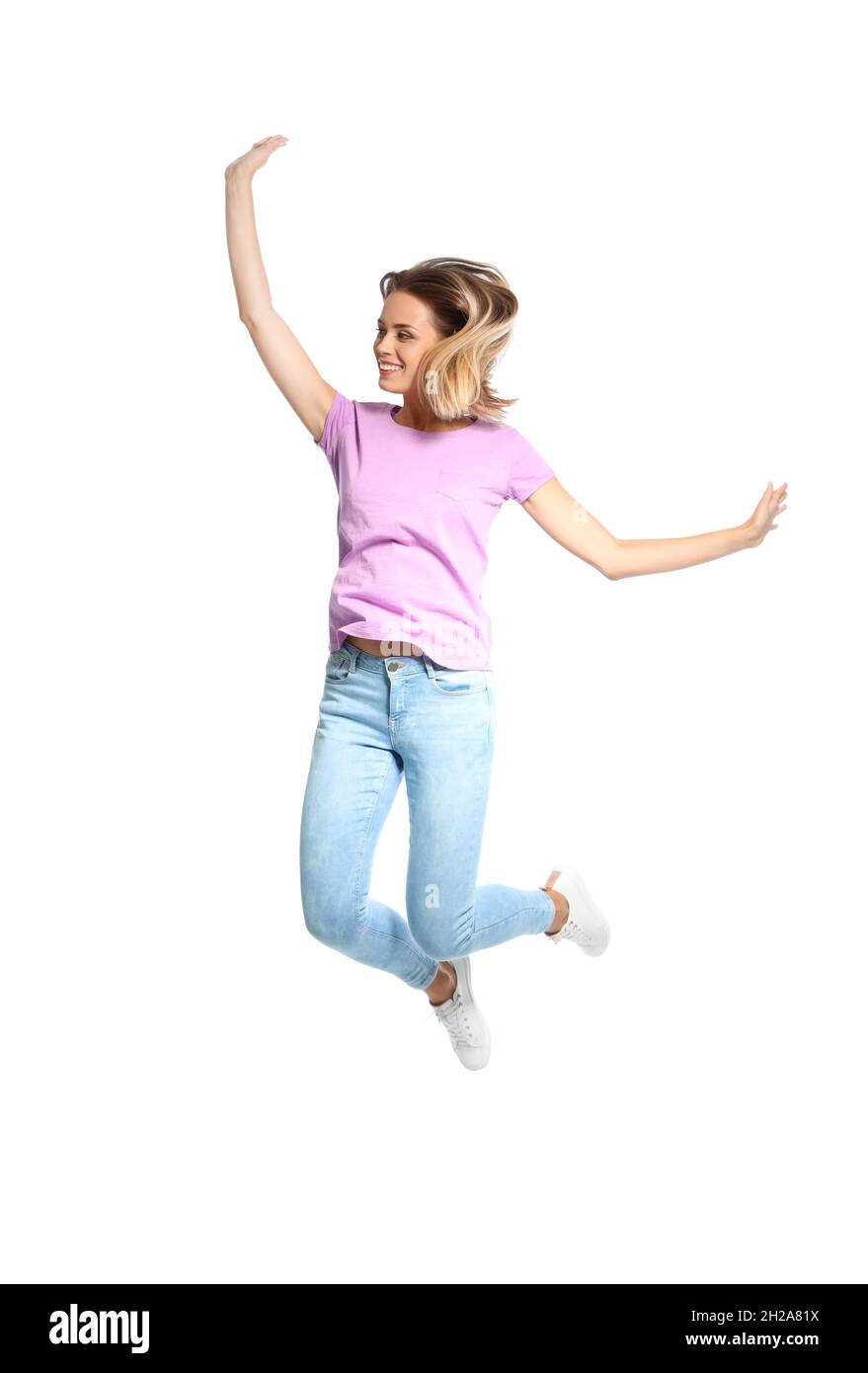 Beautiful woman jumping on white background Stock Photo - Alamy