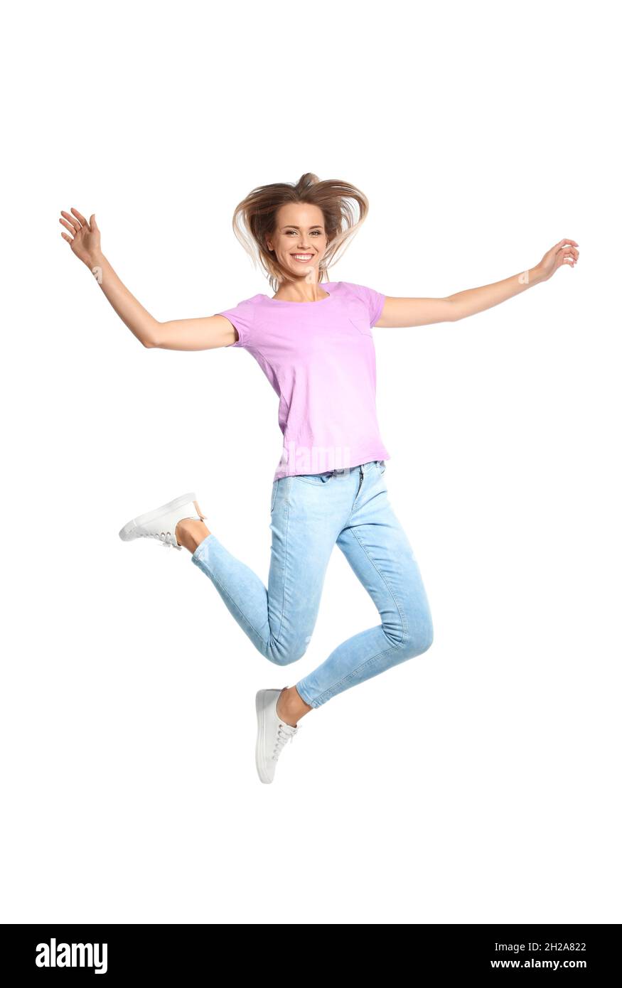 Beautiful woman jumping on white background Stock Photo - Alamy