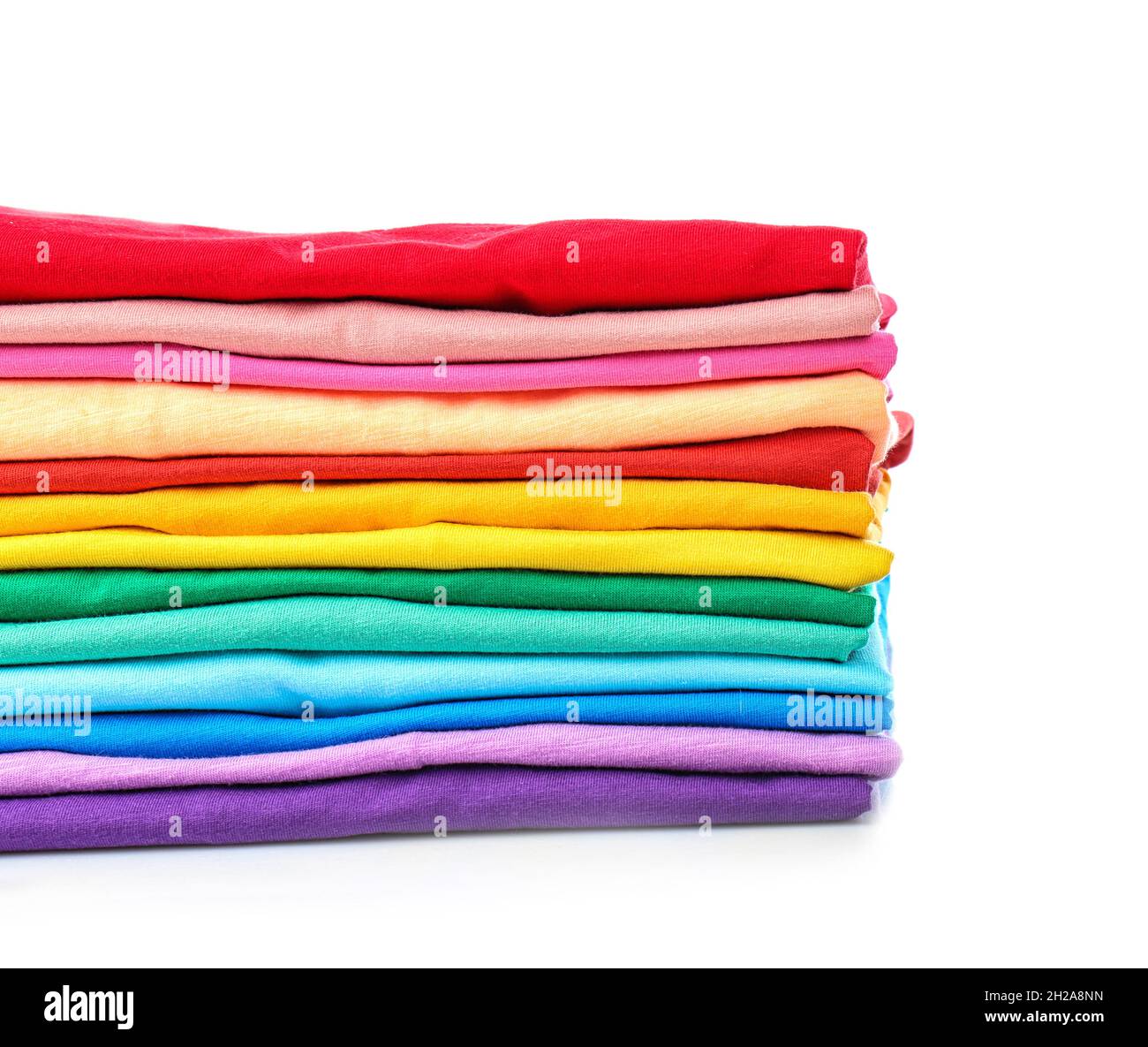 Stack of colorful t-shirts on white background Stock Photo - Alamy