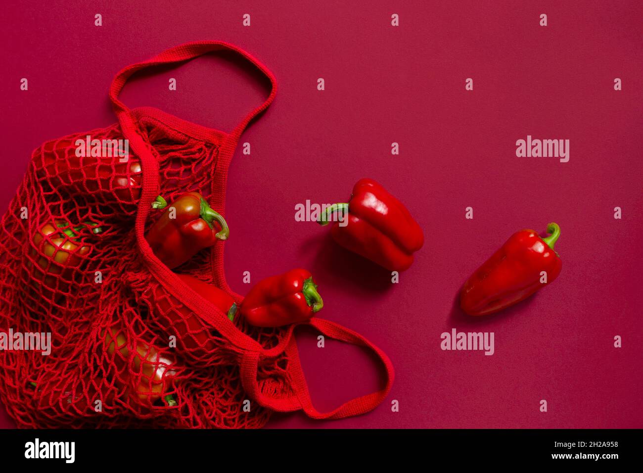 Fresh bell peppers in eco friendly bag. Monochrome red colours Stock ...