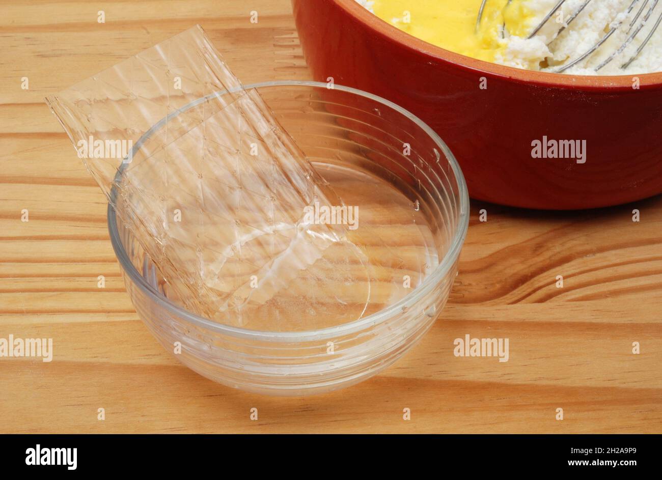 Leaves of gelatine (isinglass) in a glass bowl Stock Photo - Alamy