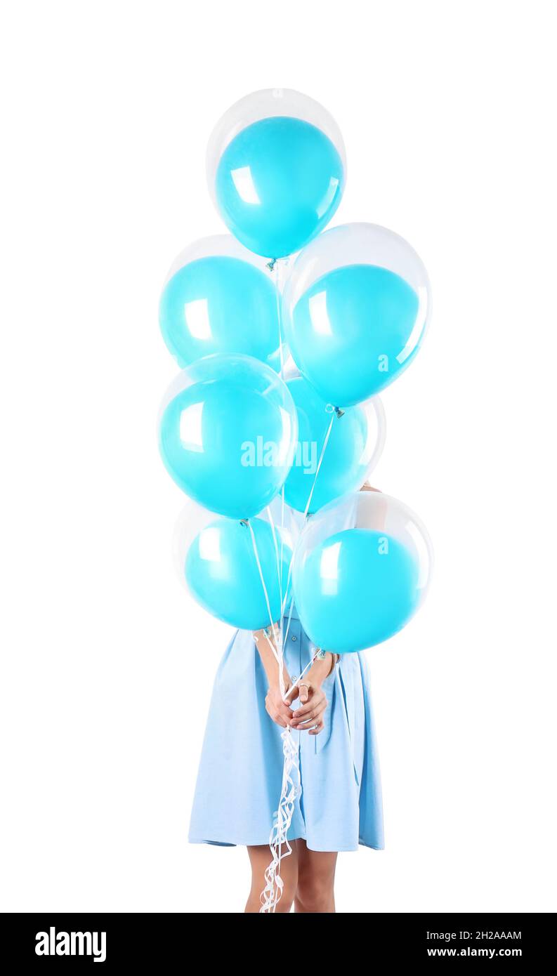 Young woman hiding behind air balloons on white background Stock Photo ...