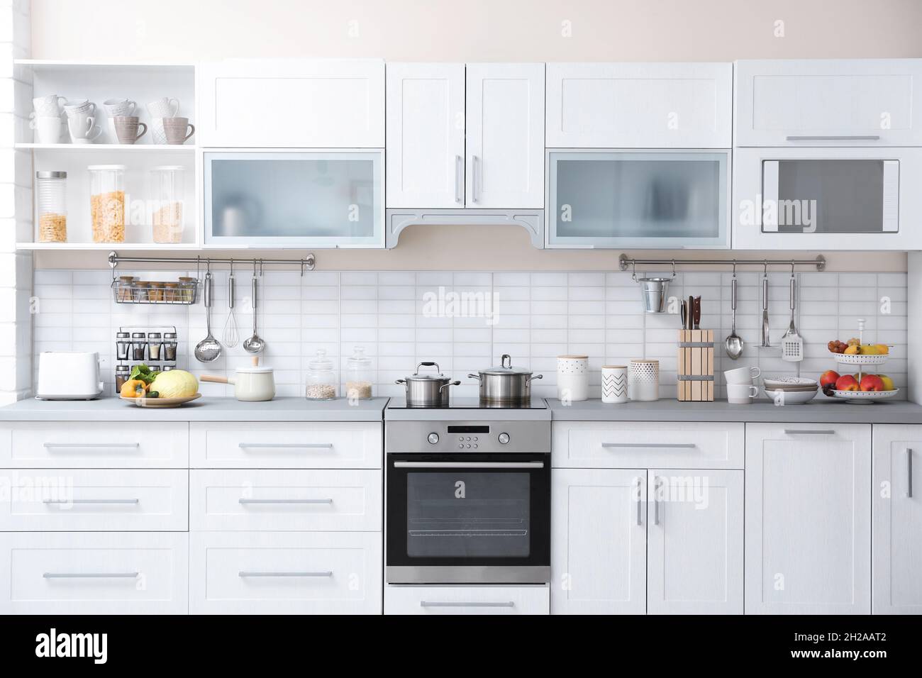 Modern kitchen interior with houseware and new furniture Stock Photo ...