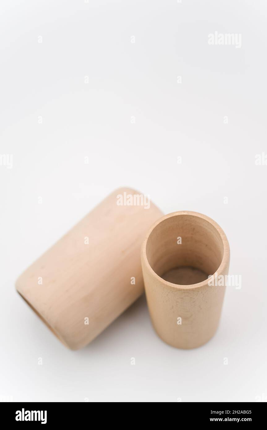 two wooden empty pen holder on a white background Stock Photo - Alamy