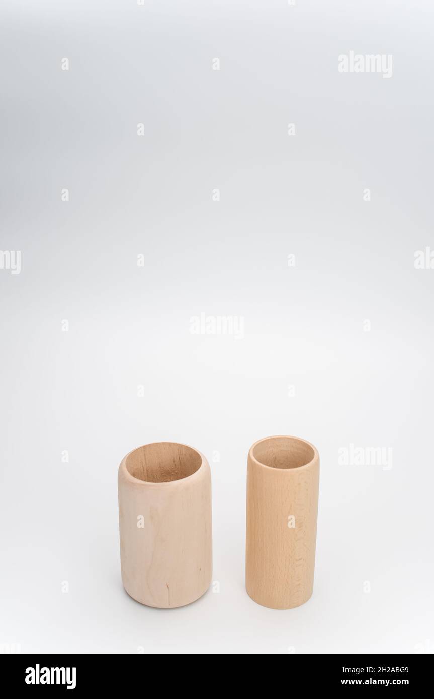 two wooden empty pen holder on a white background Stock Photo - Alamy