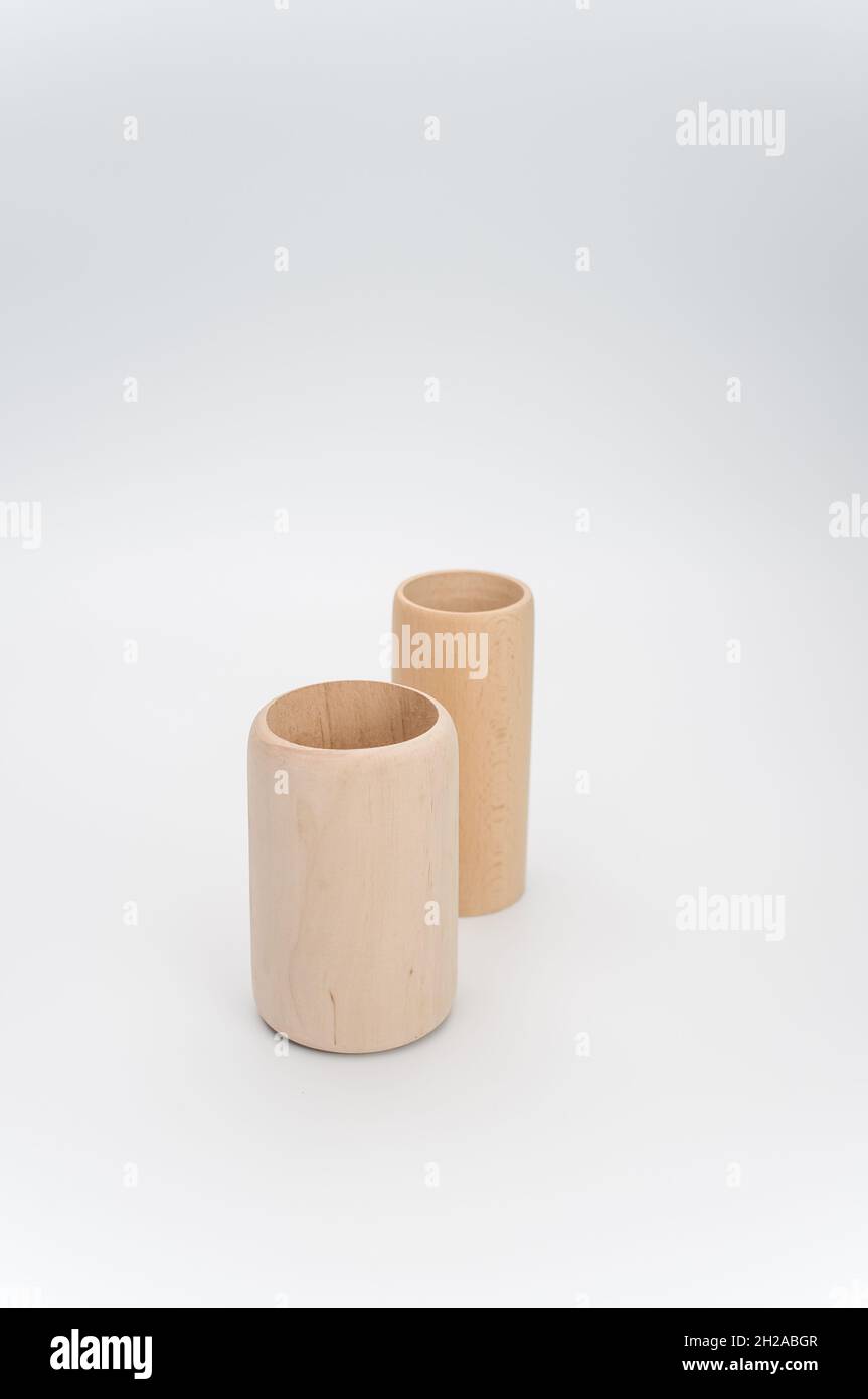 two wooden empty pen holder on a white background Stock Photo - Alamy